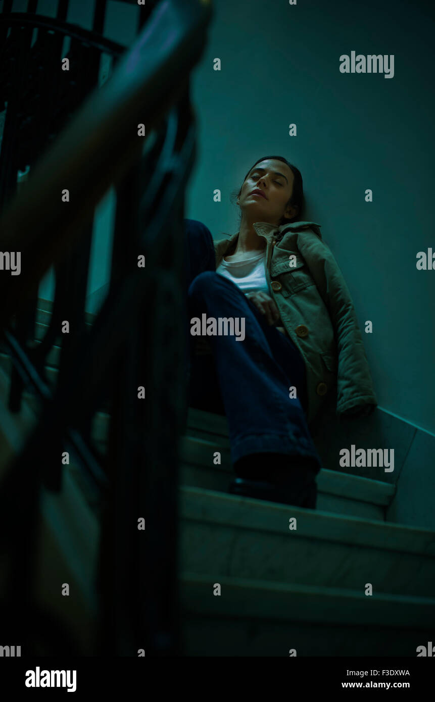 Woman sleeping on staircase Stock Photo - Alamy