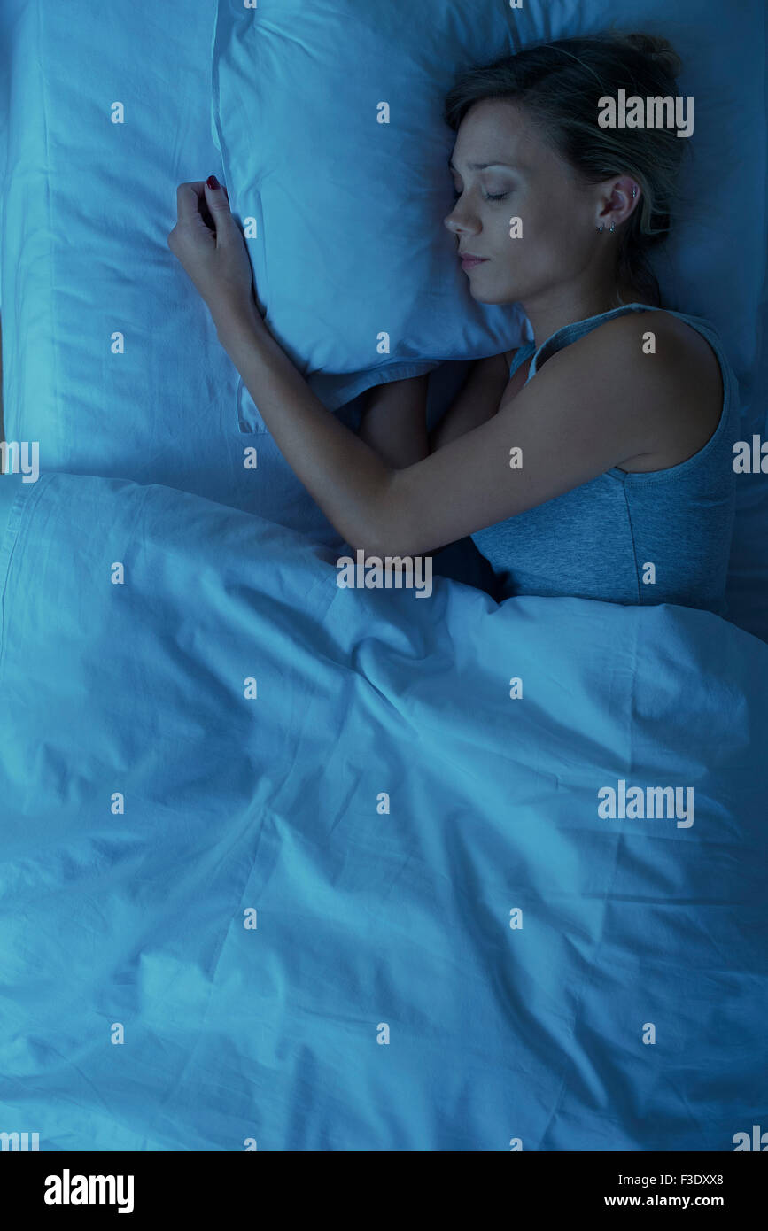 Woman sleeping peacefully in bed hi-res stock photography and images ...