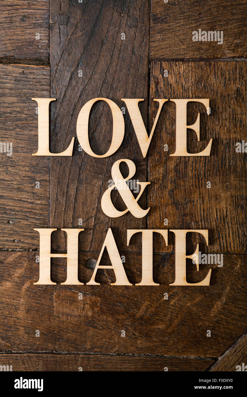 Wooden letters forming words LOVE & HATE written on old vintage wooden ...