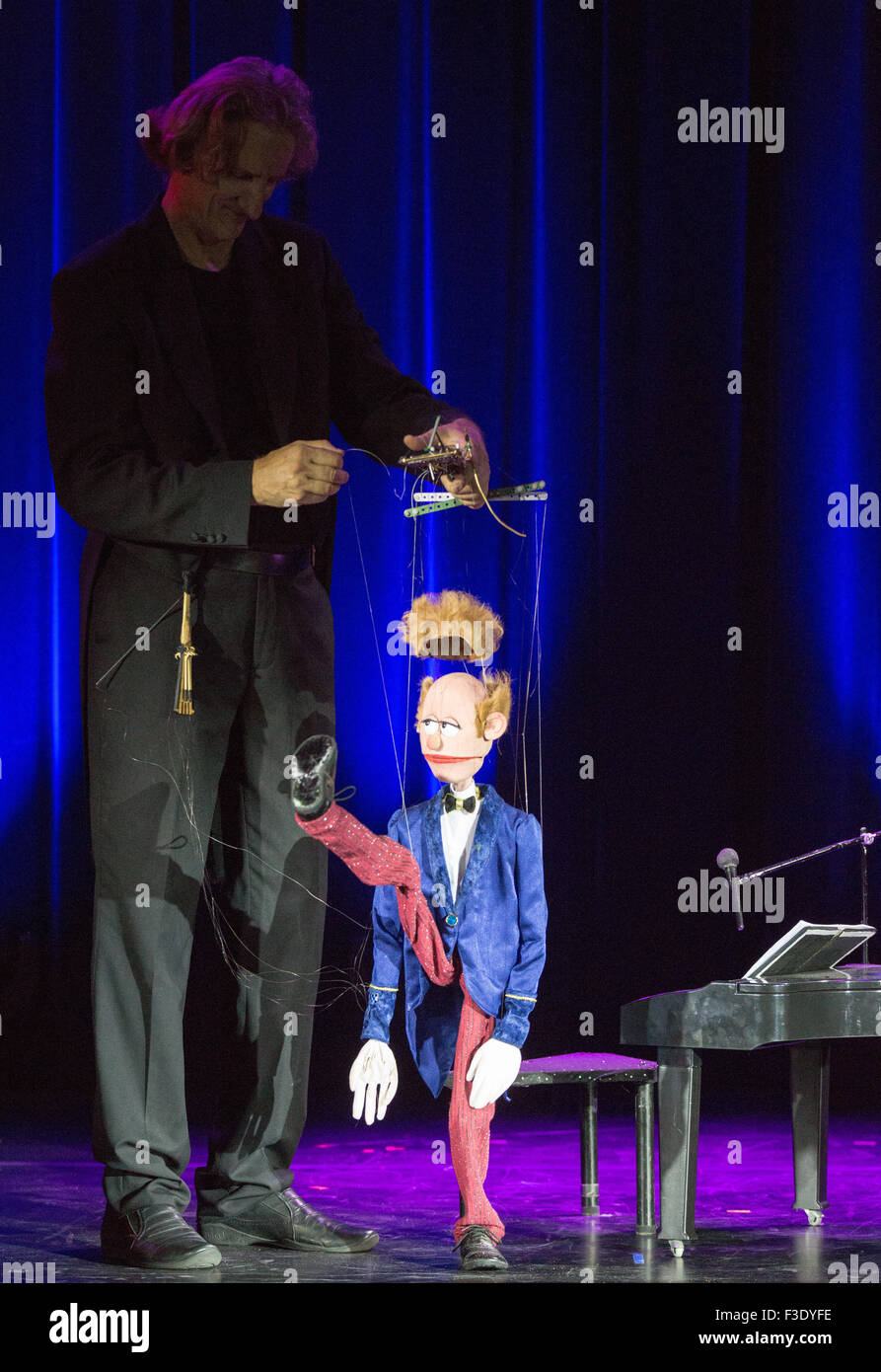 Macedonian puppeteer Alex Mihailovski performs on stage with his puppet ...