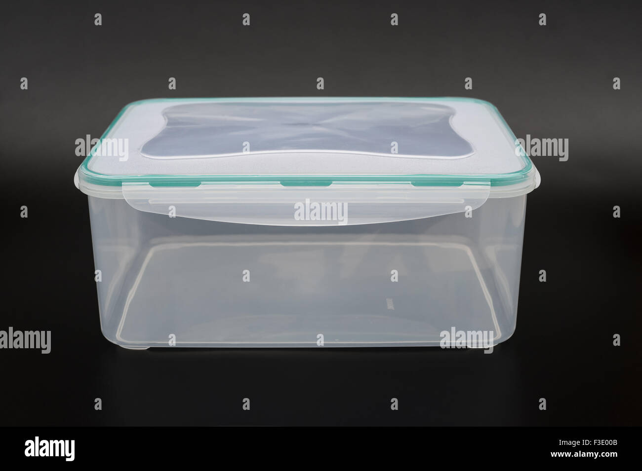 translucent storage box on a black background Stock Photo - Alamy