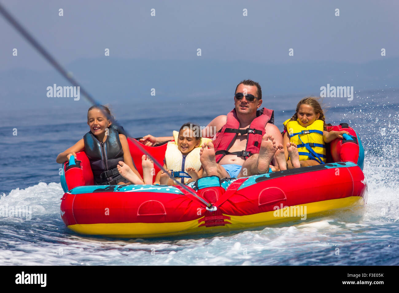 Family ride on the sea Stock Photo - Alamy