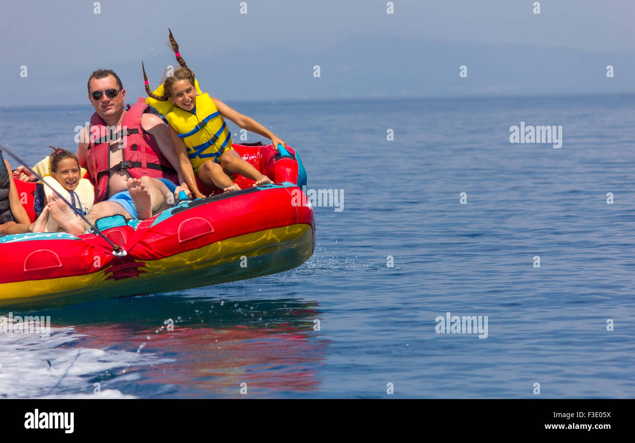 Family ride on the sea Stock Photo - Alamy