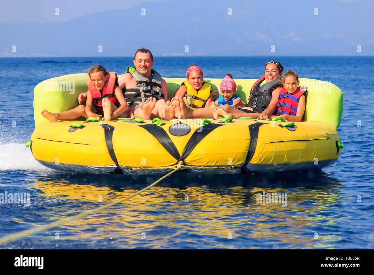 Family ride on the sea Stock Photo - Alamy