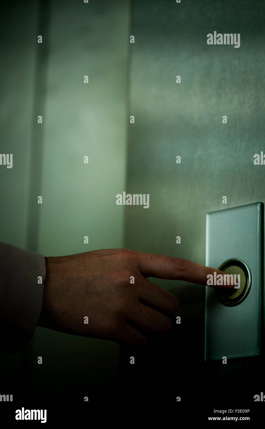 Pushing door bell Stock Photo - Alamy