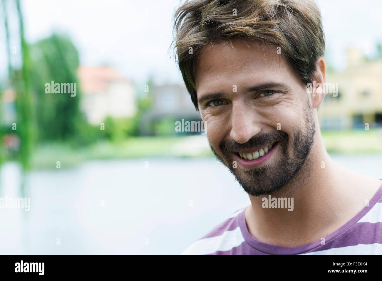 Man smiling cheerfully, portrait Stock Photo - Alamy