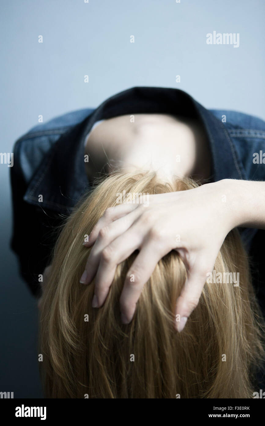 Hand caressing woman's blonde locks Stock Photo - Alamy