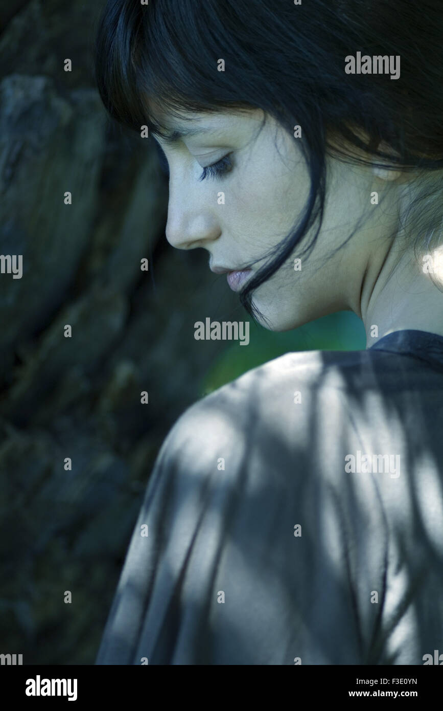 Woman looking down sadly, portrait Stock Photo - Alamy