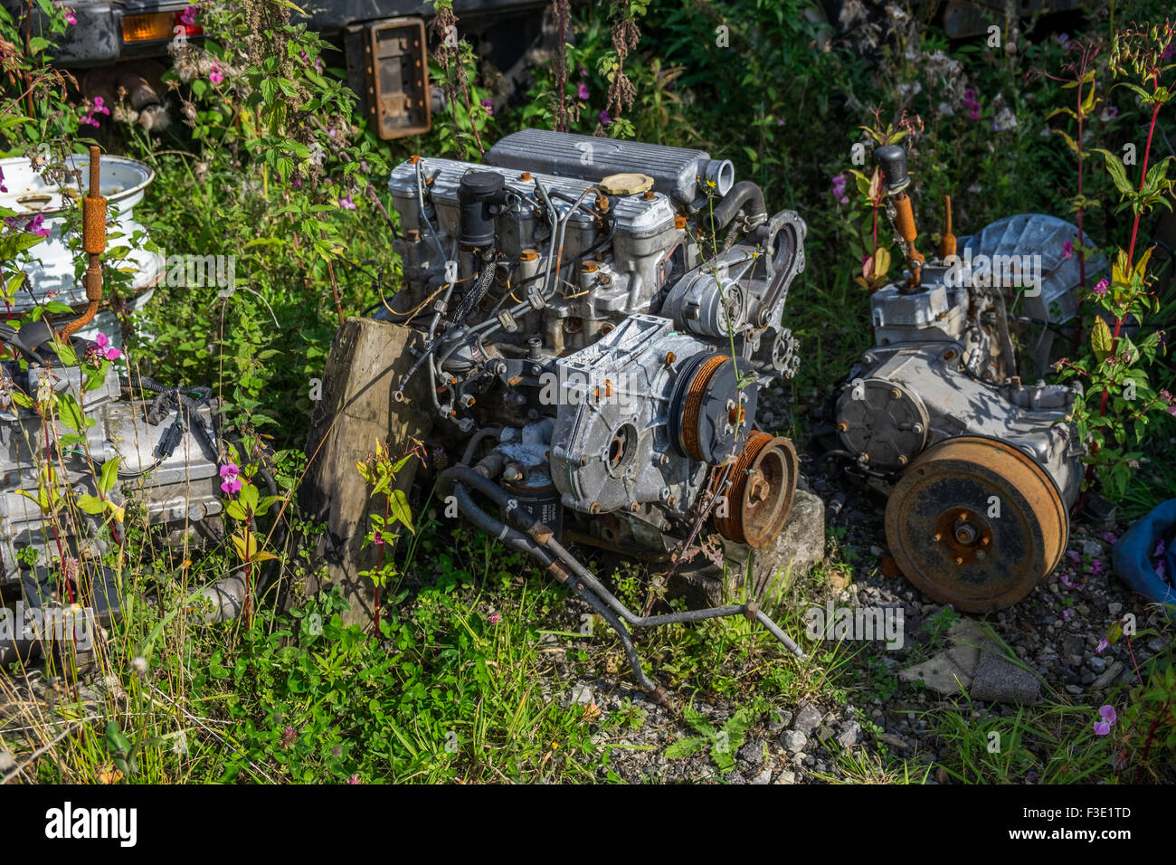 Old disused motor vehicle engines left in a field to rot and go rusty ...