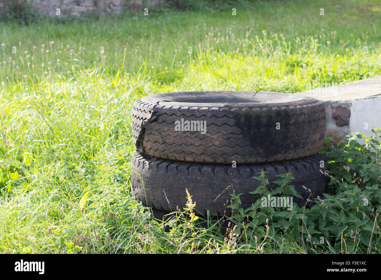Tires on a field Stock Photo - Alamy