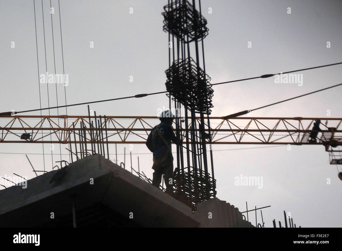 Manila. 6th Oct, 2015. A laborer works at a construction site in Manila ...