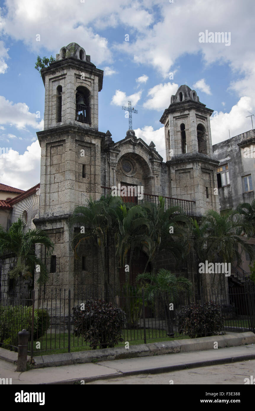 Ancient Spanish architecture church in downtown Havana on a small ...