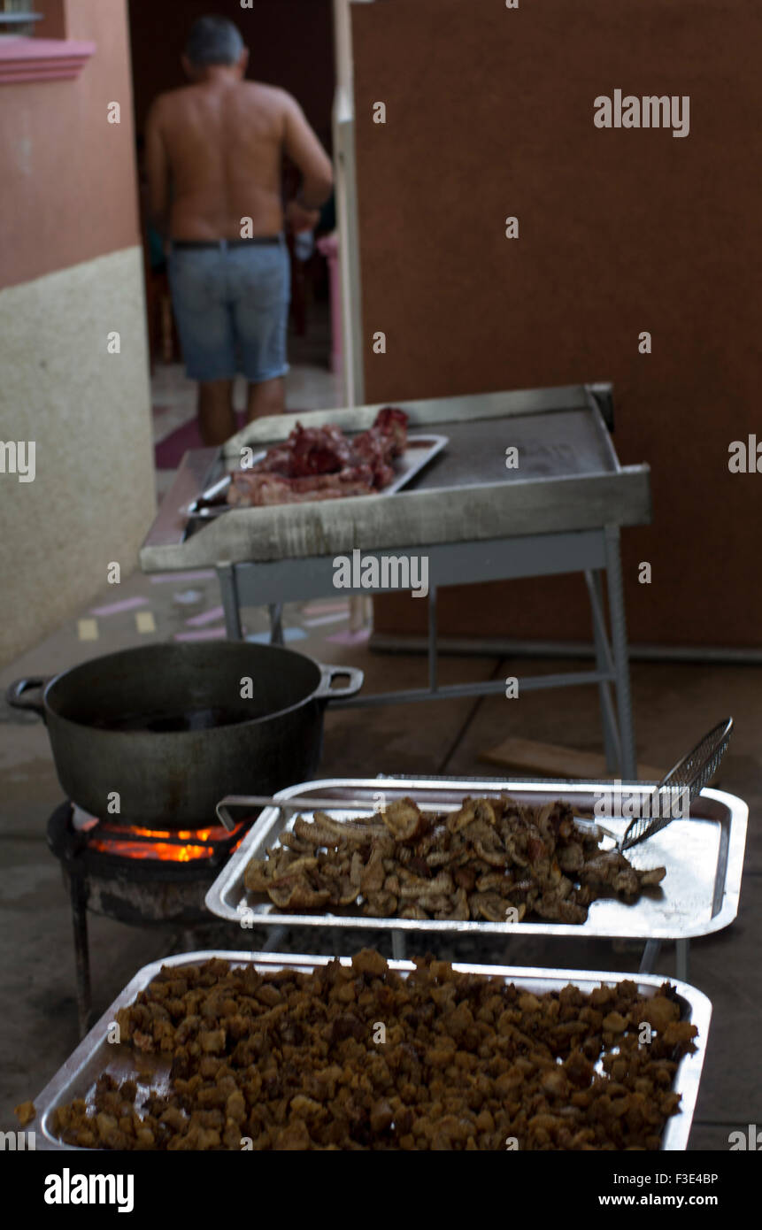 Cooking Cuban cuisine, chicharron, pork rind or pork scratchings on the ...