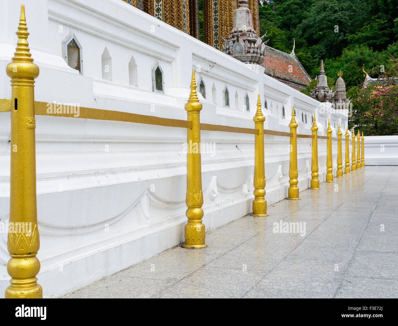 Outdoor walkway with gold wooden rails at the Buddhist Temple Stock ...