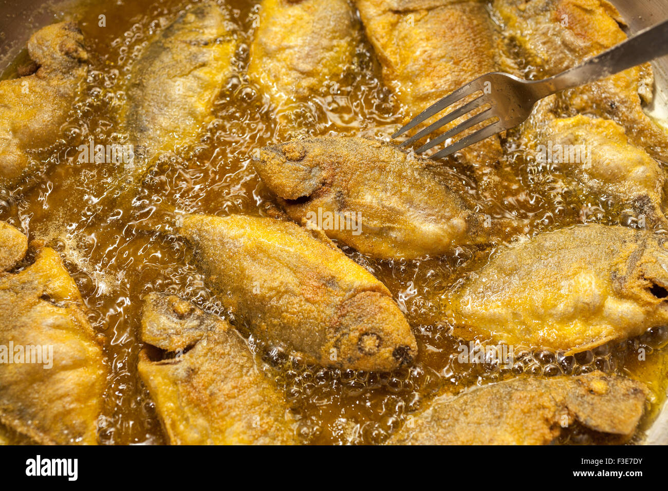 Small fishes of the Greek sea roasted in the frying pan Stock Photo - Alamy