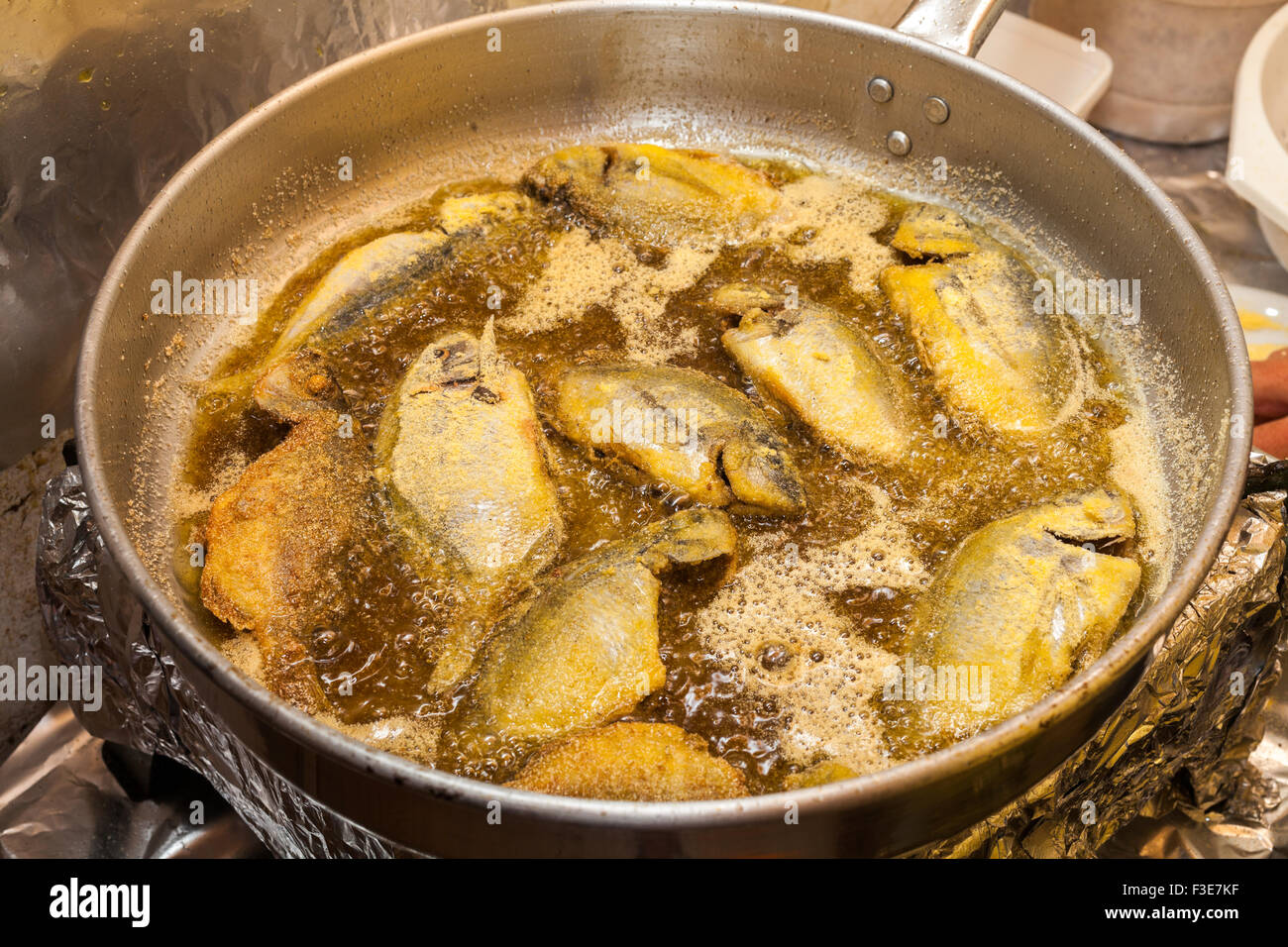 Small fishes of the Greek sea roasted in the frying pan Stock Photo - Alamy