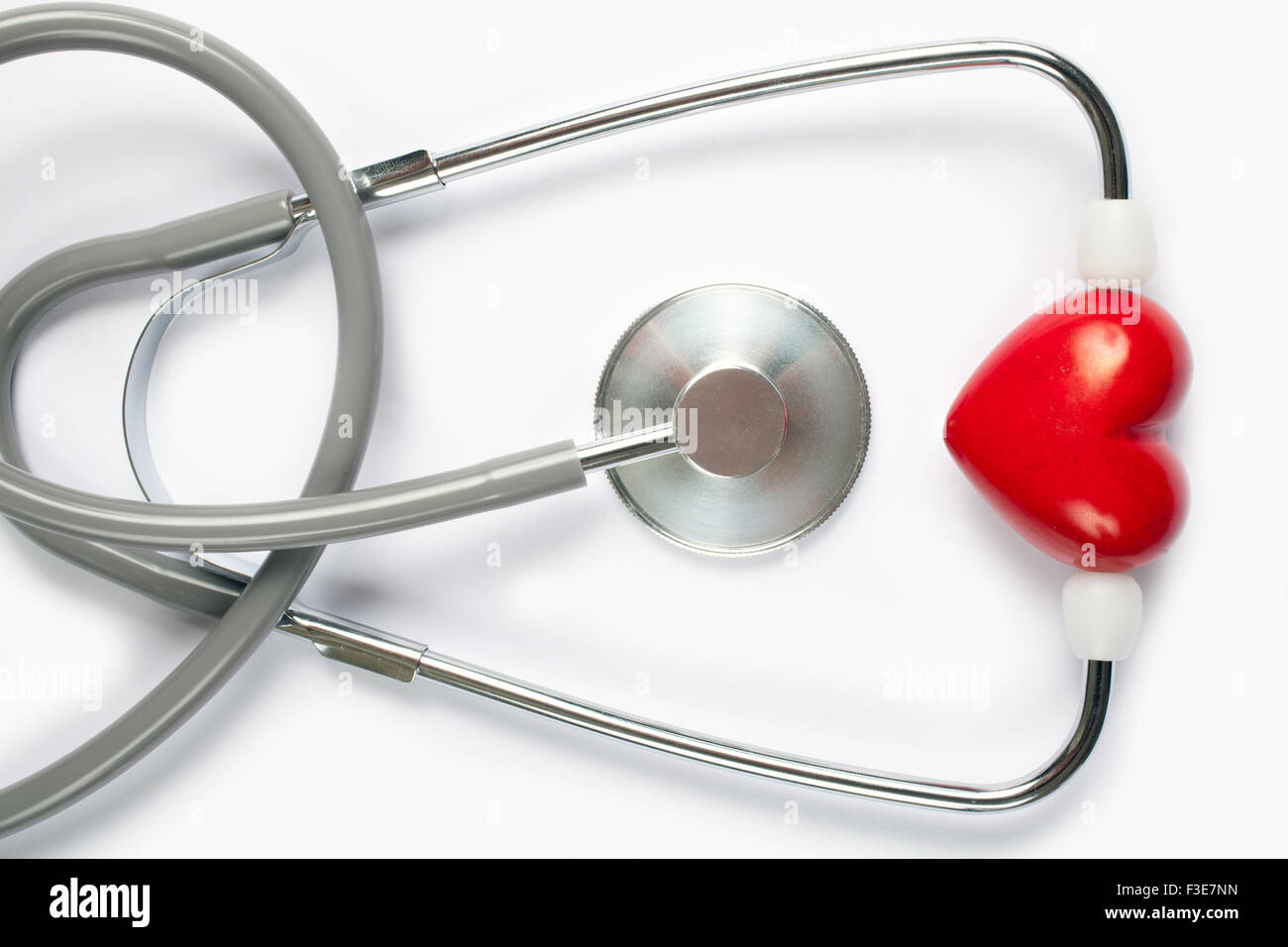 Stethoscope & red heart on white background Stock Photo - Alamy