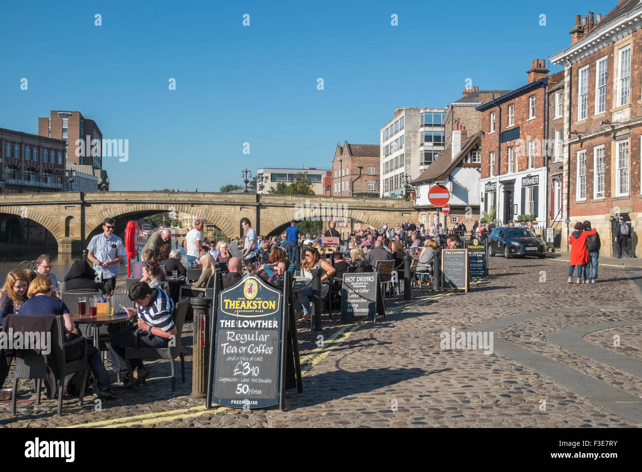 People taking refreshments at historic Kings Staith, York, North ...