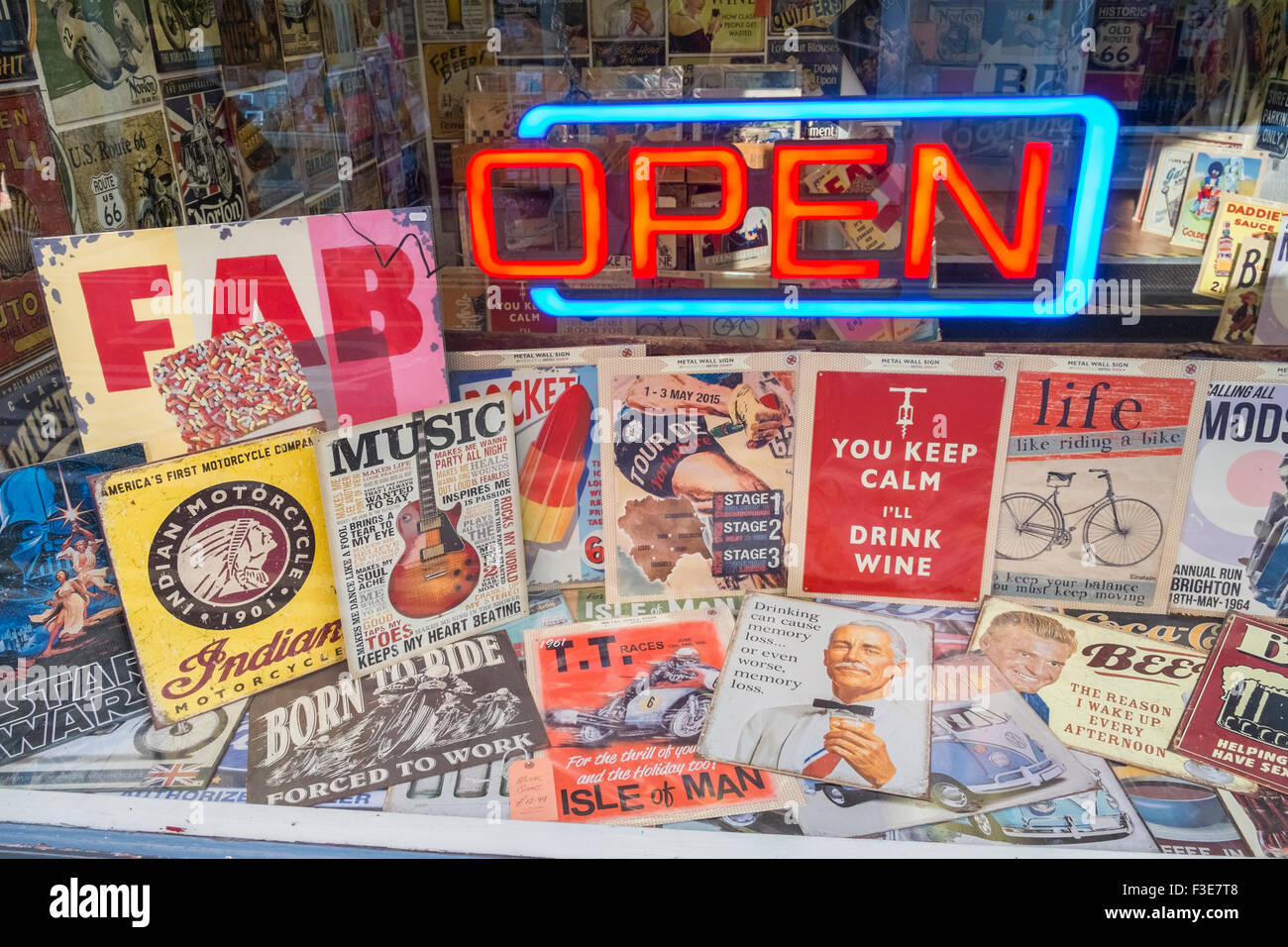 Shop window display of nostalgic posters, with neon 'Open' sign Stock ...