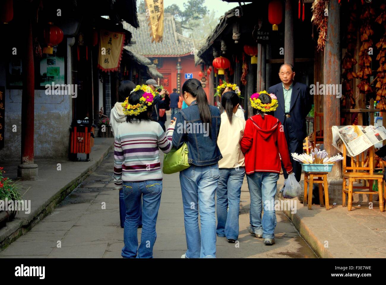Huang Long Xi, China: Women wearing traditional floral wreath hats ...