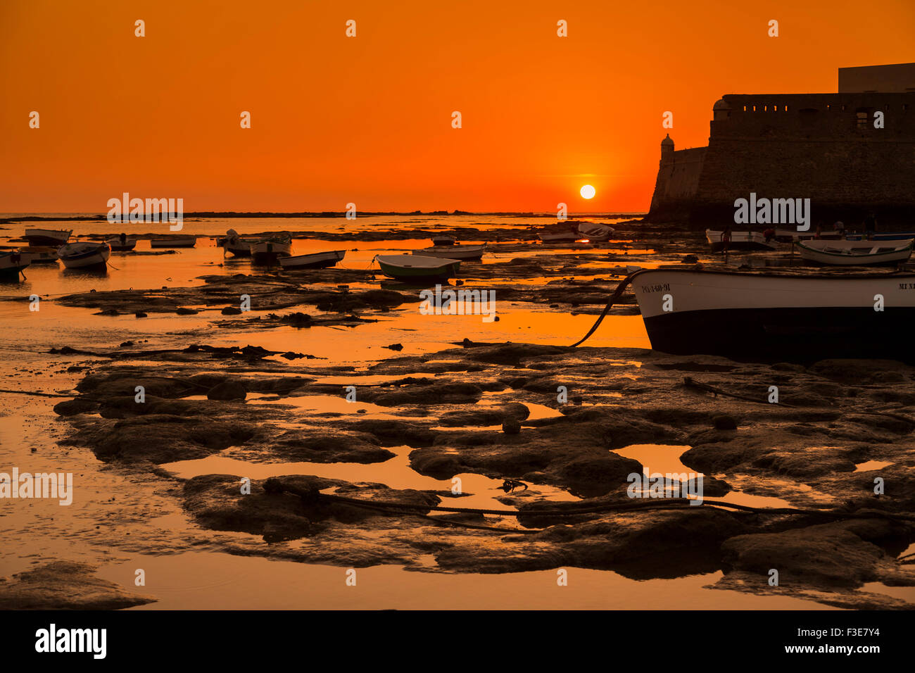 La Caleta beach boats sunset Cadiz Andalusia Spain Stock Photo - Alamy