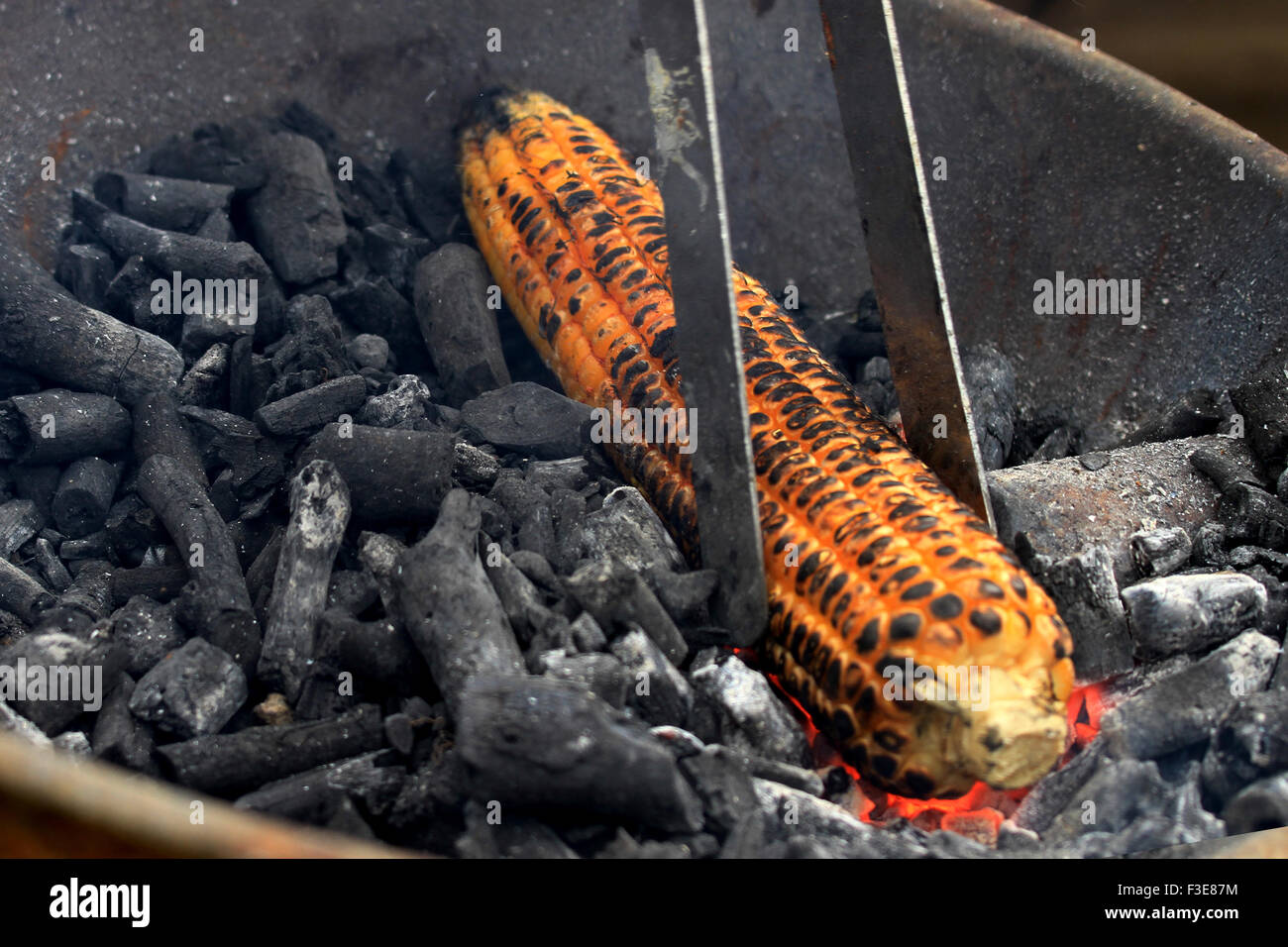 Hot corn in charcoal Stock Photo - Alamy