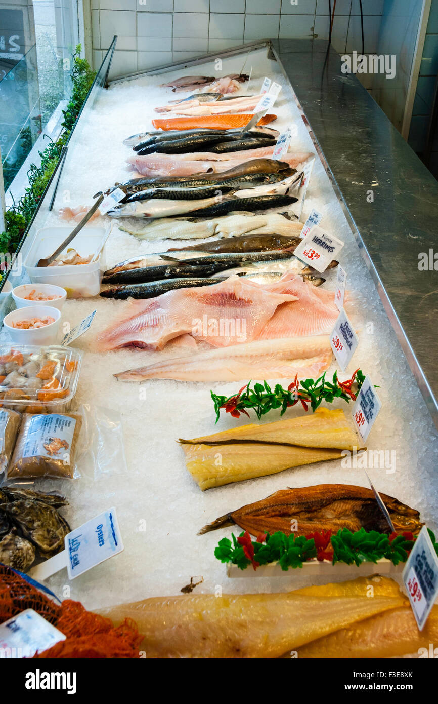 Typical English wet fish, fish monger shop. Window display of various ...