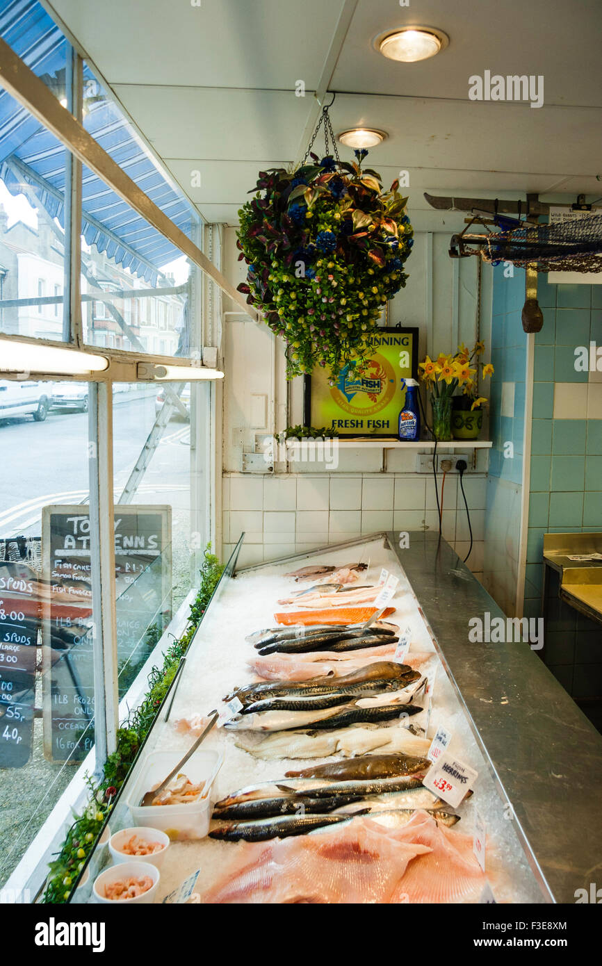Typical English wet fish, fish monger shop. Window display of various ...