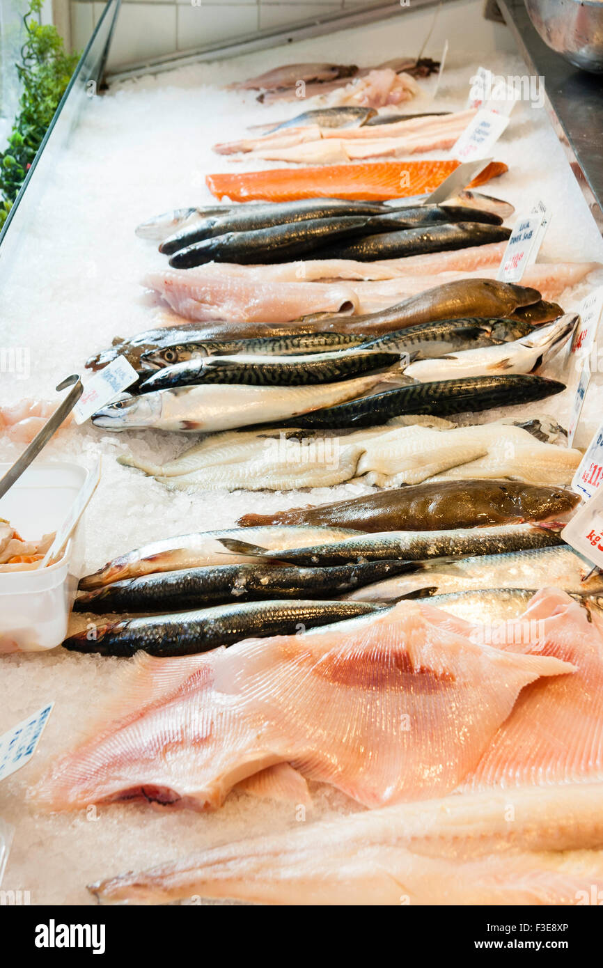 Typical English wet fish, fish monger shop. Window display of various ...