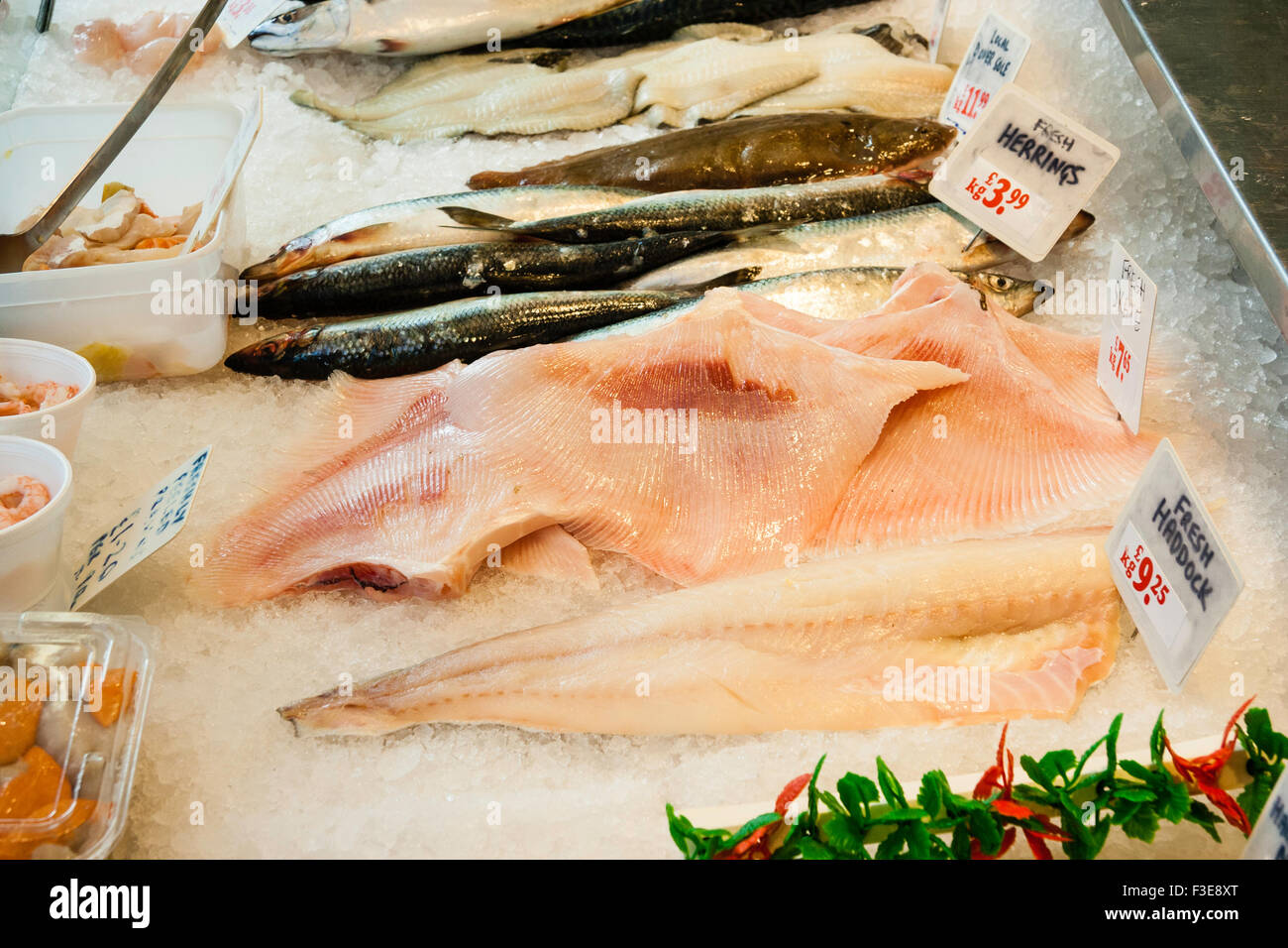 Typical English wet fish, fish monger shop. Window display of various ...