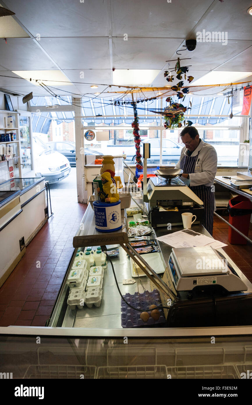 Interior of typical English wet-fish fish mongers shop. View along ...