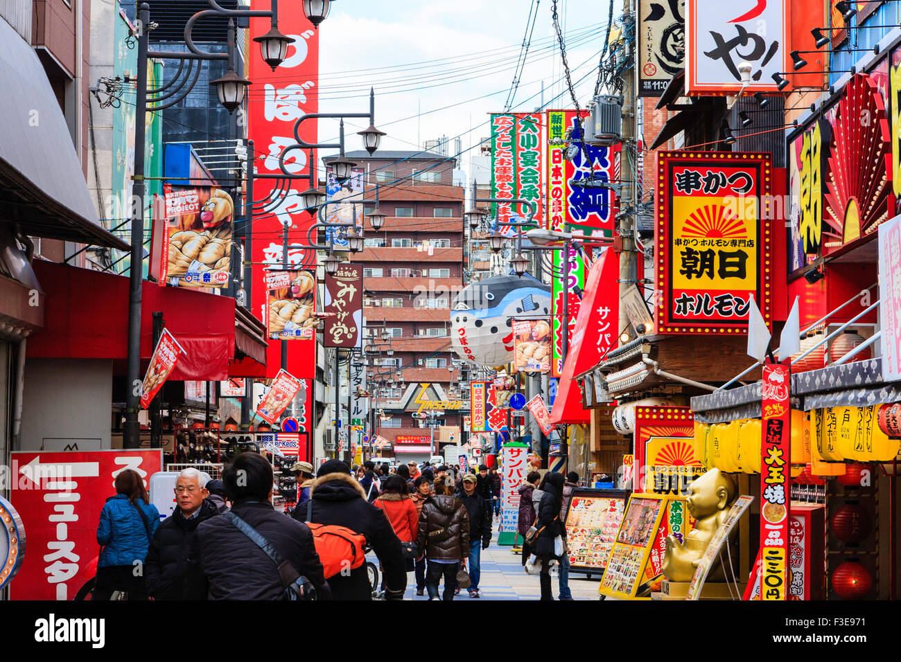 Shinsakei, in downtown Osaka. View along street with many signs and ...