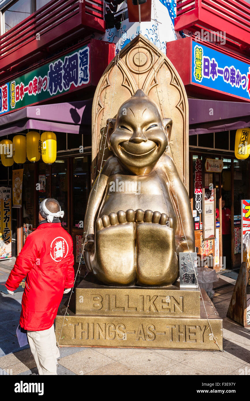 Osaka, Shinsekai. The famous Billiken statue outside store on main ...