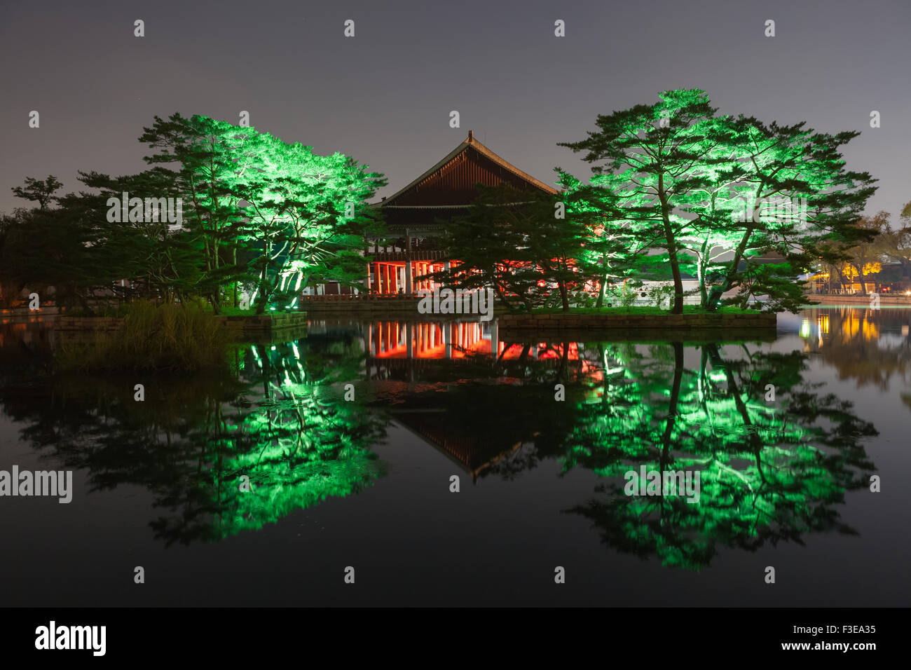 Gyeonghoeru with trees on both sides of it - Gyeongbokgung palace at ...