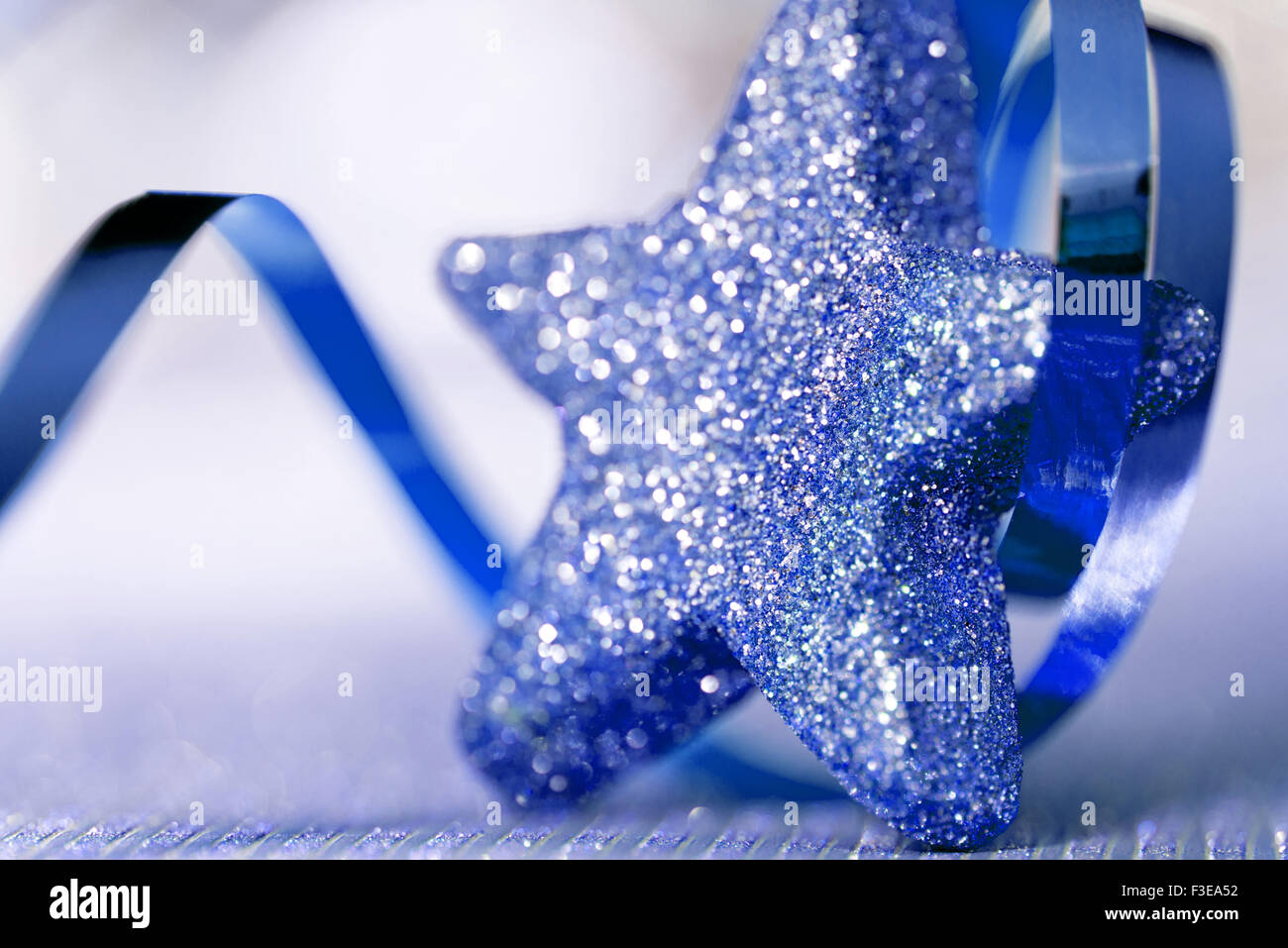 Christmas star with a ribbon Stock Photo - Alamy