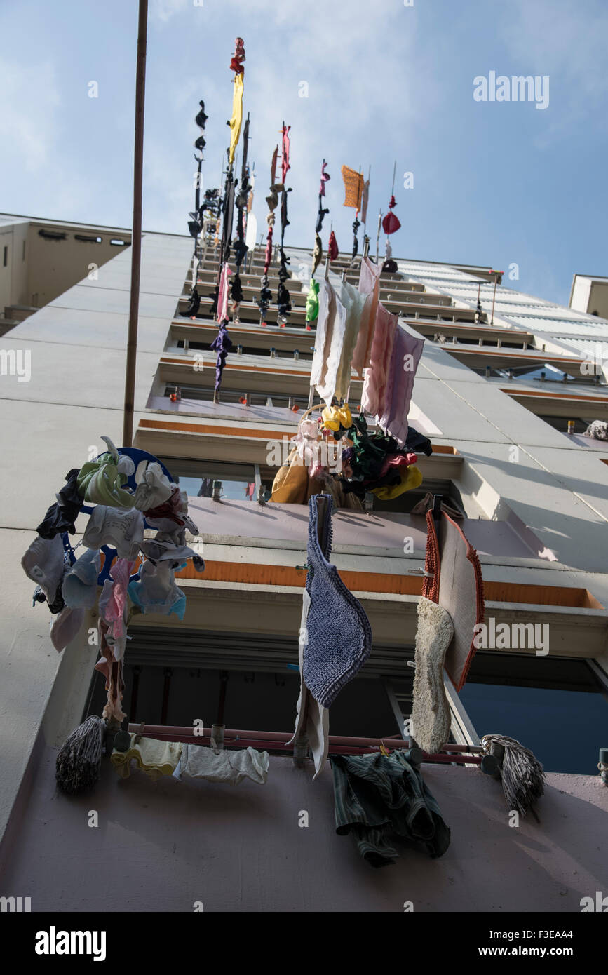 Clothes hanging to dry in an HDB social housing block in Singapore ...