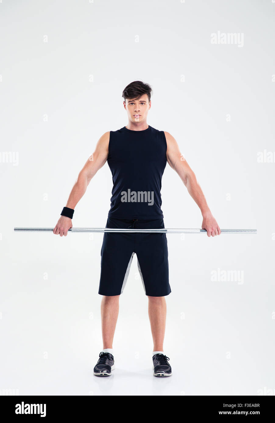 Full length portrait of a handsome fitness man workout with barbell ...