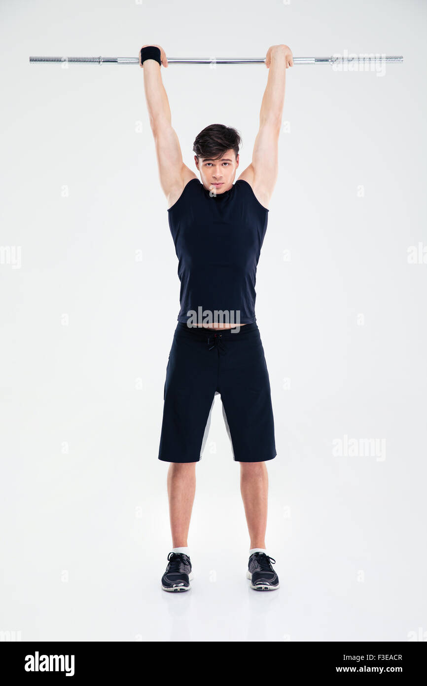 Full length portrait of a fitness man workout with barbell isolated on ...
