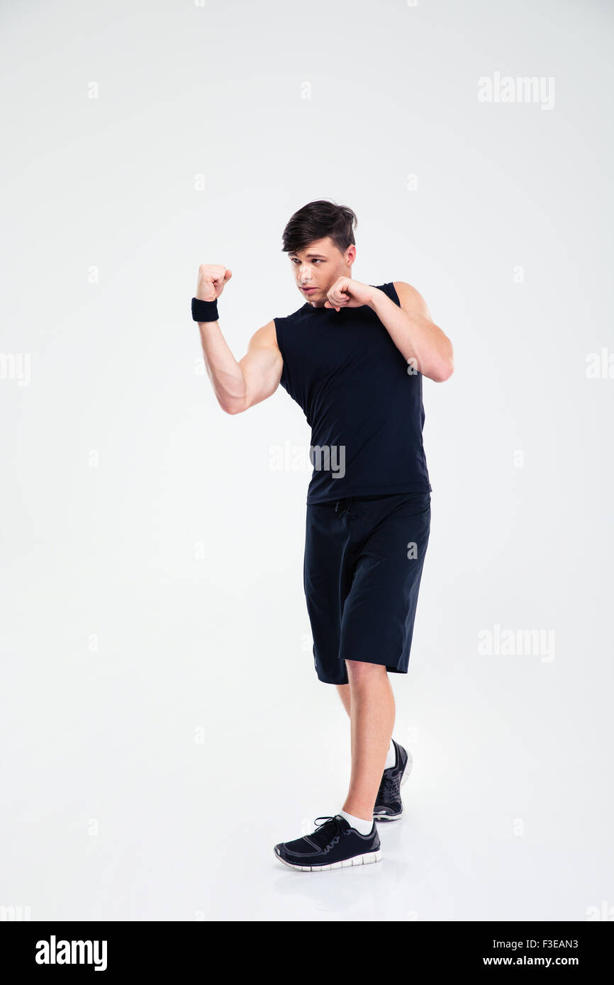 Full length portrait of a sports man boxing isolated on a white ...