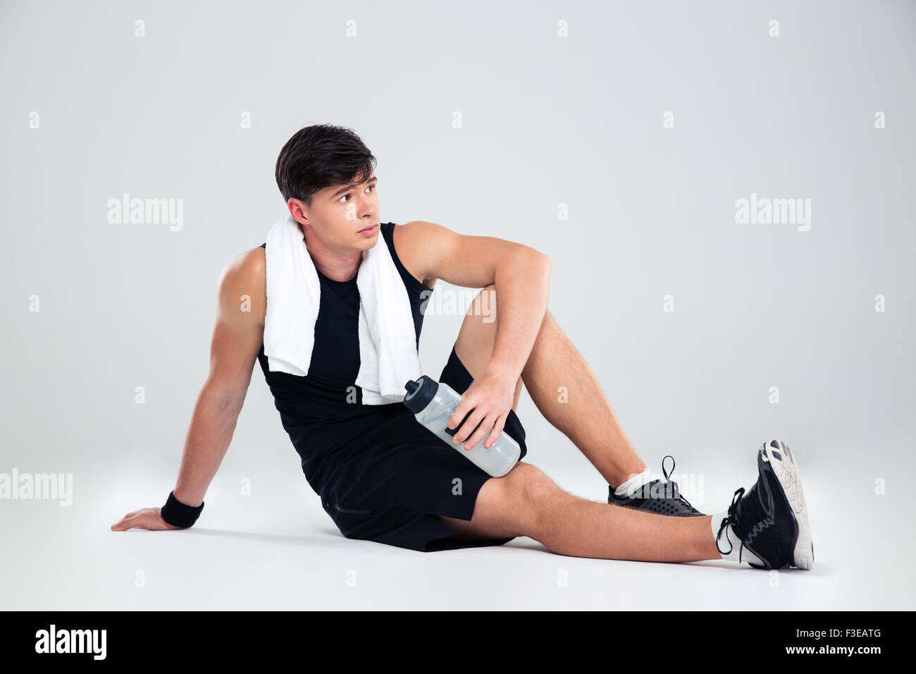 Muscular man sitting on floor hi-res stock photography and images - Alamy