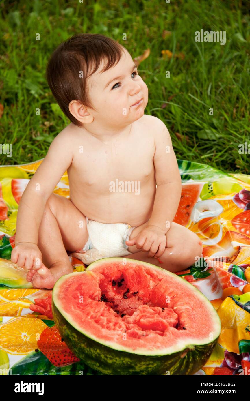 Baby eating watermelom outdoors Stock Photo - Alamy