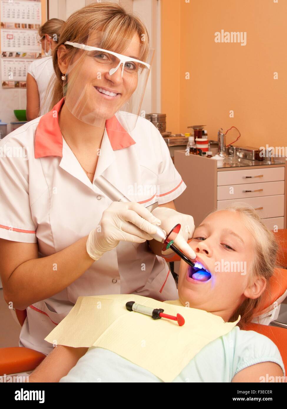 Teenage girl at the dentist Stock Photo - Alamy