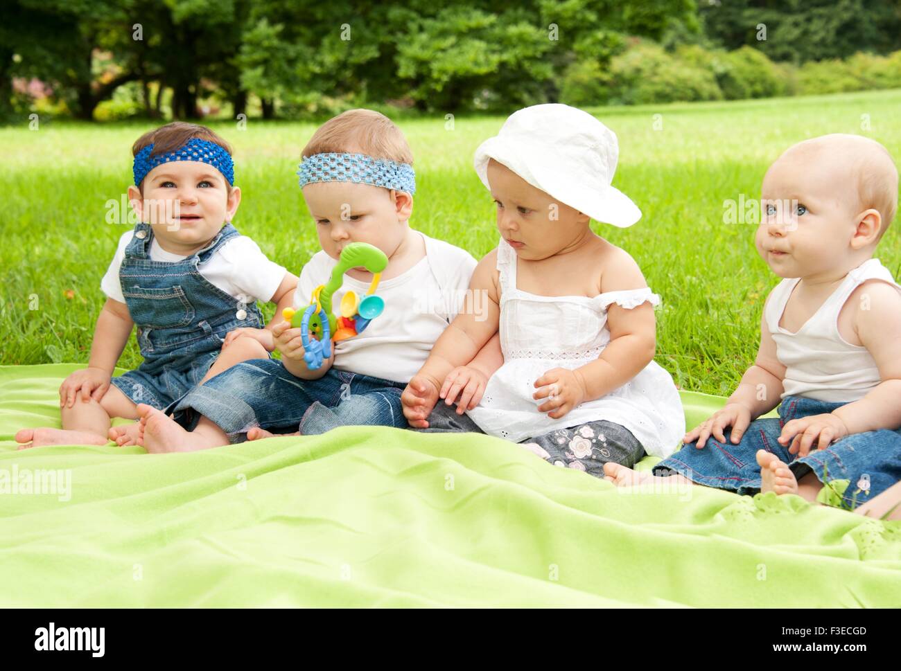 Group of babies outdoors Stock Photo - Alamy