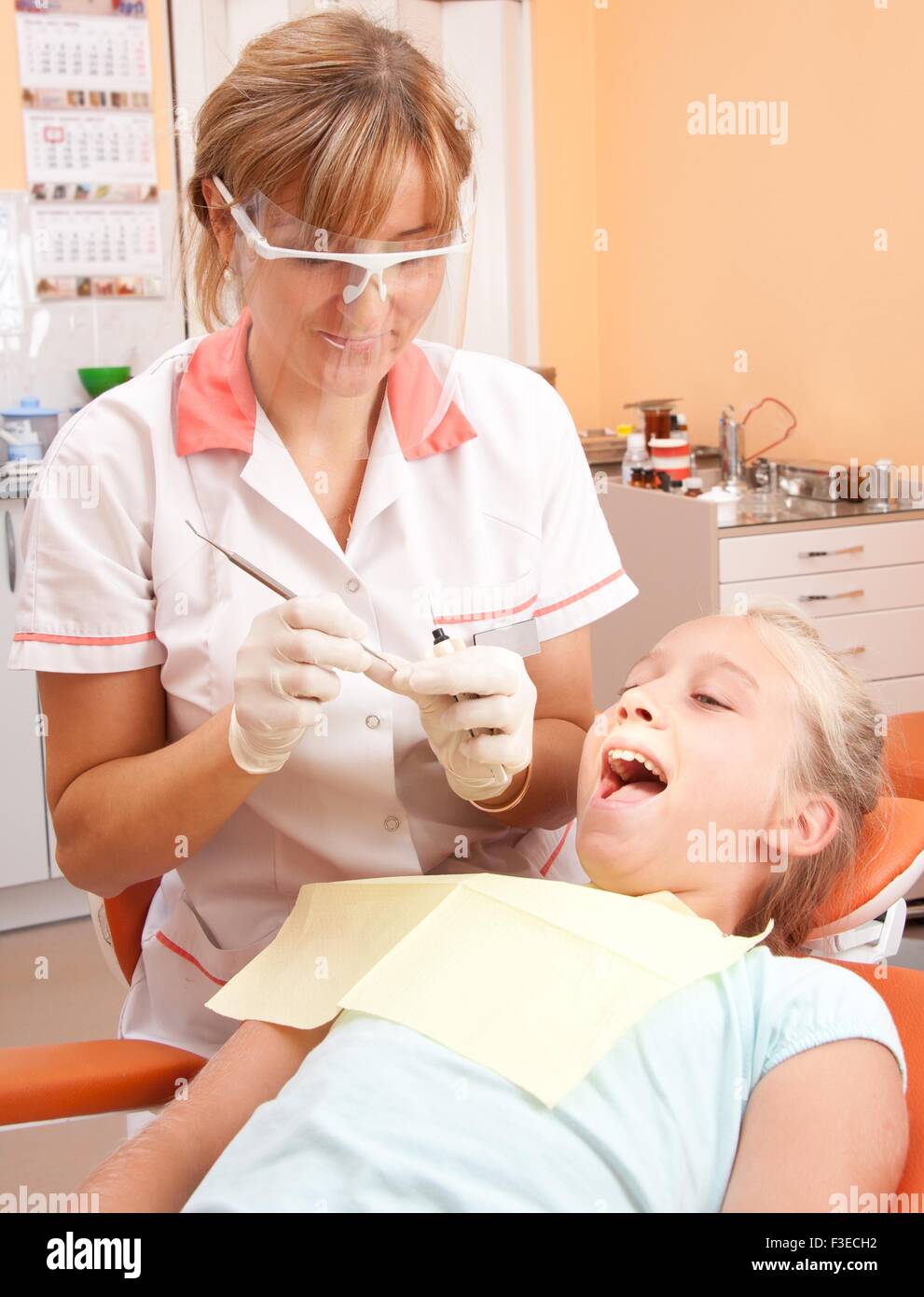 Teenage girl at a dentist Stock Photo - Alamy