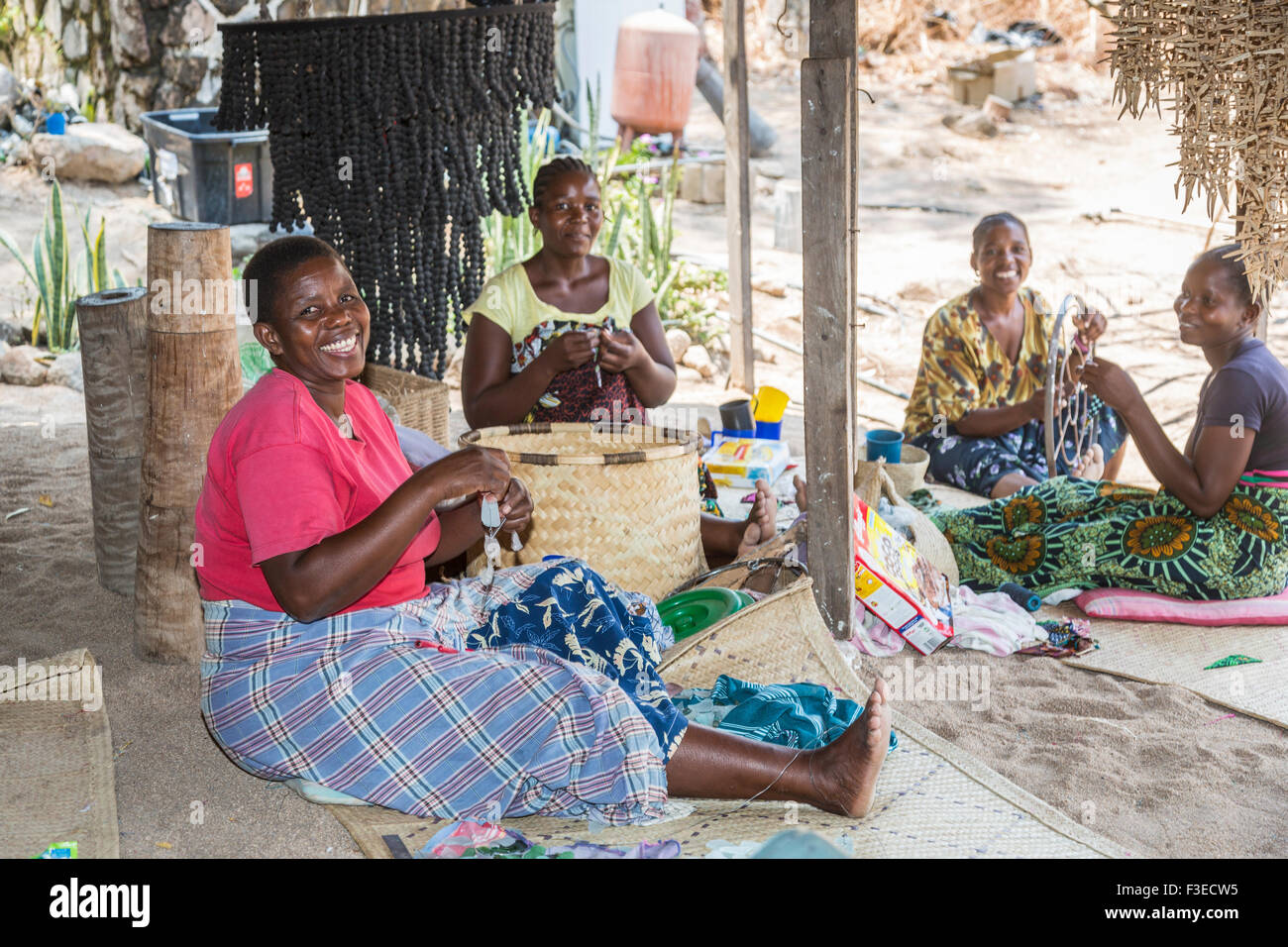 Happy friendly laughing local African women at work working at Katundu ...