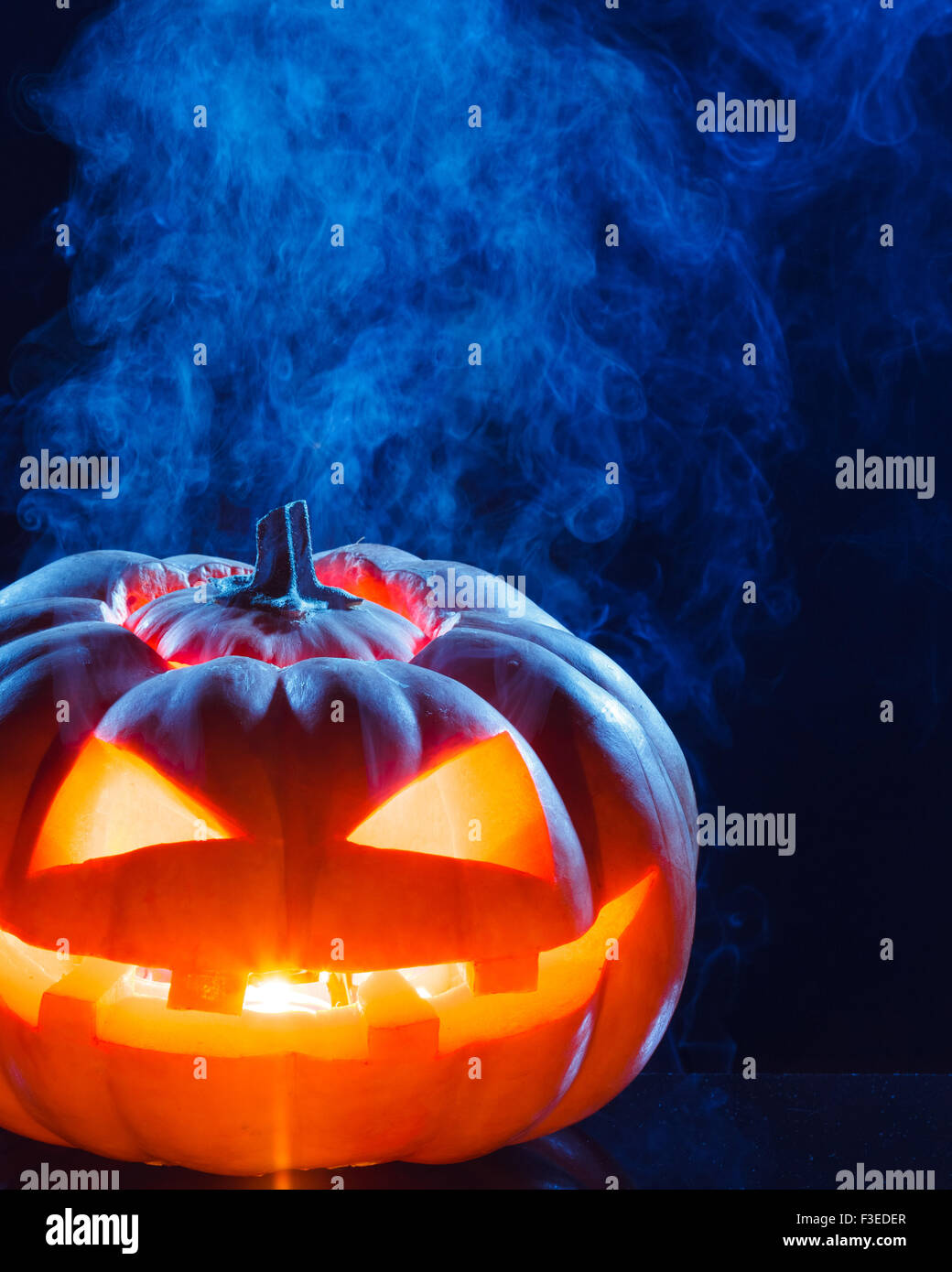 terrible pumpkin on black background Stock Photo - Alamy