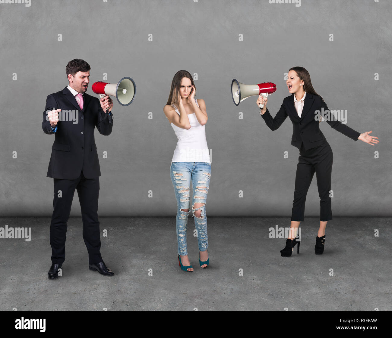 Angry colleagues speak with megaphone Stock Photo - Alamy