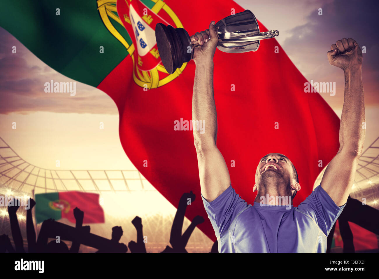 Composite image of happy rugby player holding trophy Stock Photo - Alamy