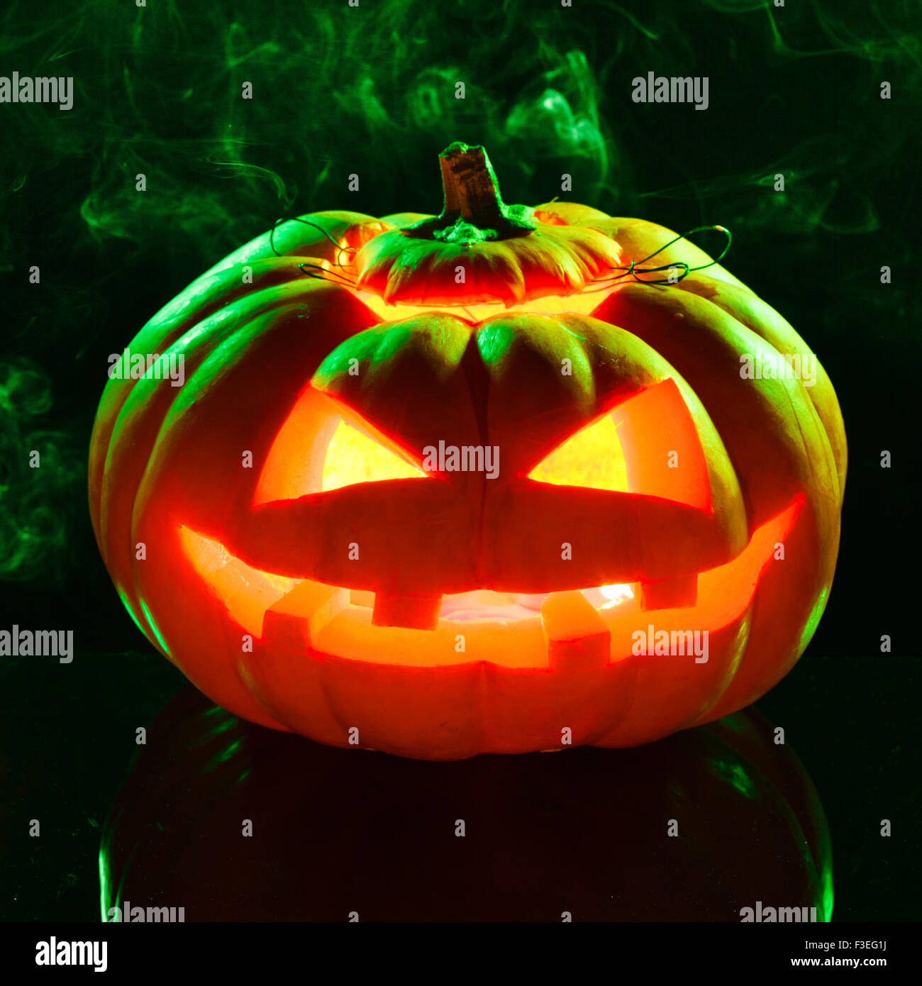 Smoking scary halloween pumpkin head Stock Photo - Alamy