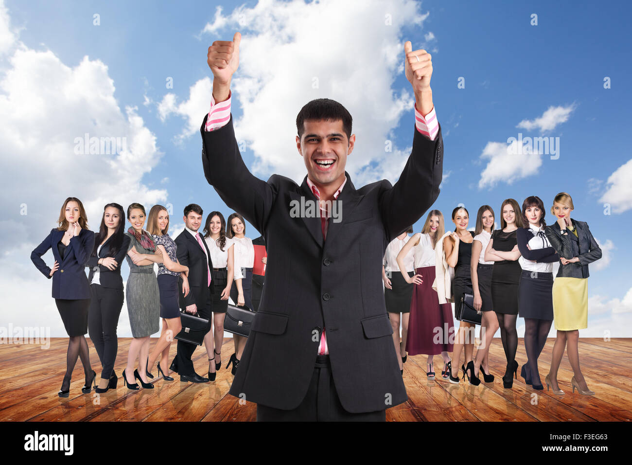 Group of business people stand under clouds sky Stock Photo - Alamy